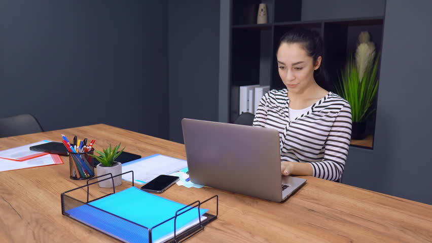 young woman sitting desk modern office Stock Footage Video (100% ...