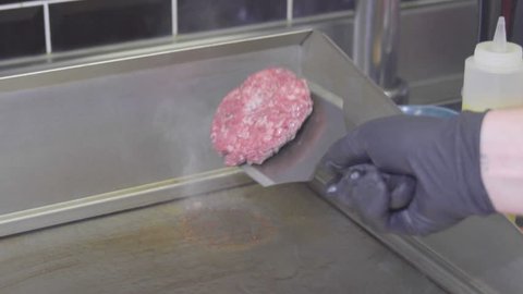 Beef Burger Patty Being Flipped On Stock Footage Video (100% Royalty ...