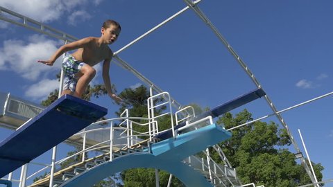Boy Jumping Springboard Diving Swimming Pool Stock Footage Video (100% ...