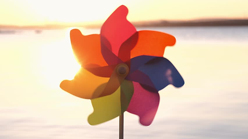 rotate plastic pinwheel blowing wind stands Stock Footage Video (100% ...