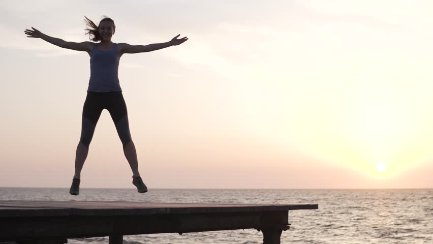 Woman Doing Jumping Jacks By : vidéo de stock (100 % libre de droit ...