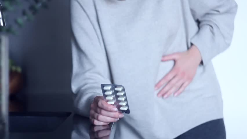 young woman grabbed her stomach while Stock Footage Video (100% Royalty ...