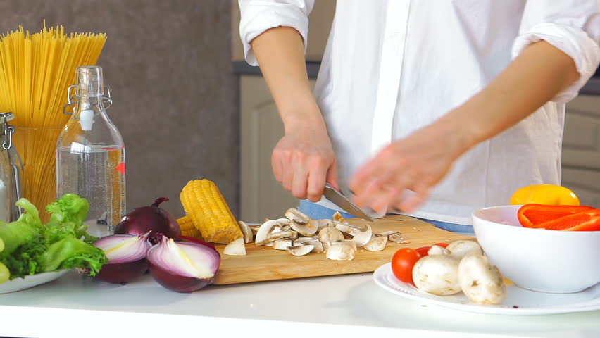 close-up young woman's hand cutting vegetables Stock Footage Video (100 ...