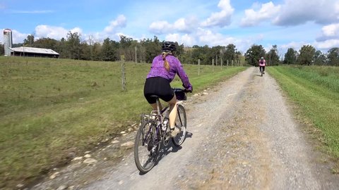 Following Behind Woman Biking Her Son Stock Footage Video (100% Royalty ...