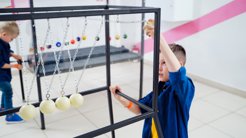 Children Science Center Experimenting Newtons Cradle Stock Footage ...