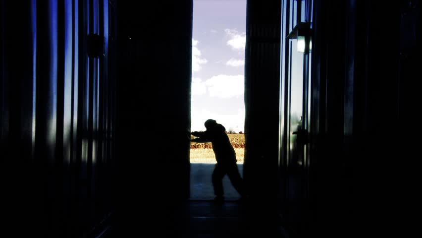 man opening gate large warehouse cloudy Stock Footage Video (100% ...