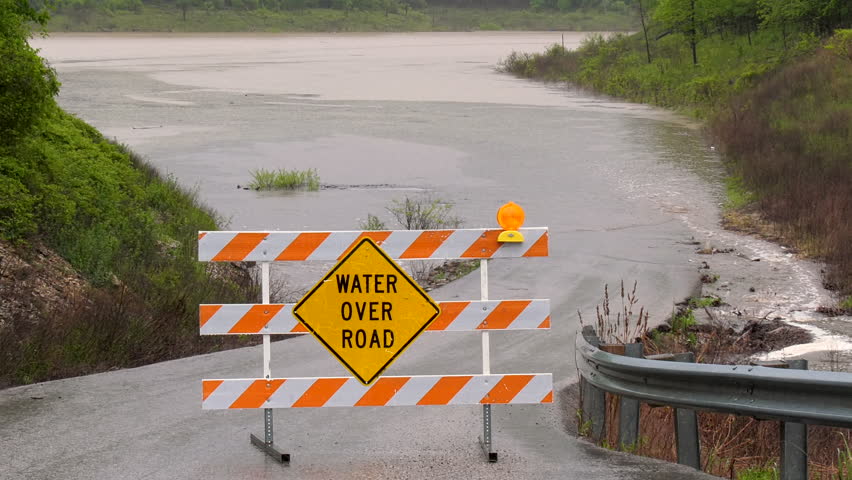 water over road sign where flooded Stock Footage Video (100% Royalty ...