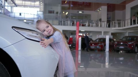 Cute Smiling Child Girl Hugs Car Stock Footage Video (100% Royalty-free ...