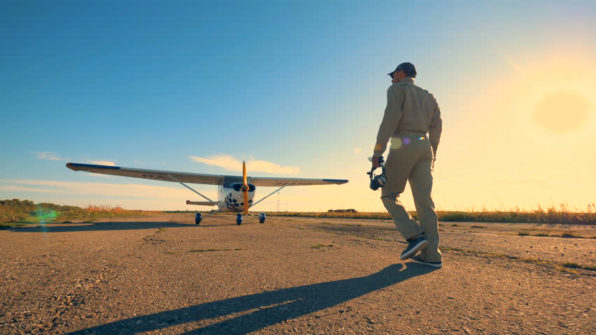 pilot walking on airfield check airplane Stock Footage Video (100% ...