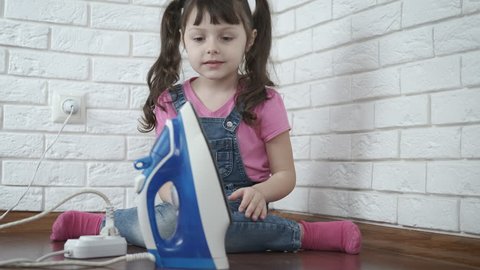 Child Touching Hot Iron Child Danger Stock Footage Video (100% Royalty ...