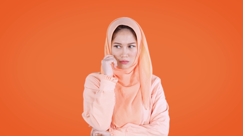 4K locked shot half portrait young beautiful Muslim woman wearing black ...