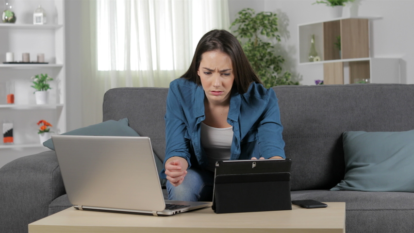 Worried Woman Using Multiple Devices Stock Footage Video (100% Royalty ...