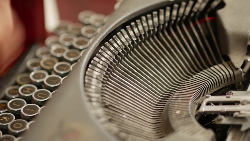 Closeup side view on batwing typewriter. Writing text "typewriter" on ...