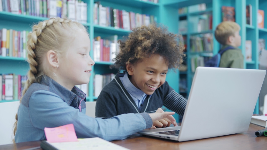 elementary school students looking laptop computer Stock Footage Video ...