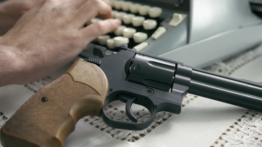 typing on typewriter revolver gun side Stock Footage Video (100% ...