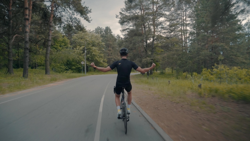 professional cyclist raising his arms victoriously Stock Footage Video ...