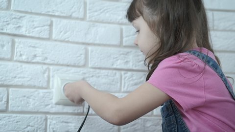 Child Electricity Kid Puts Plug Socket Stock Footage Video (100% ...