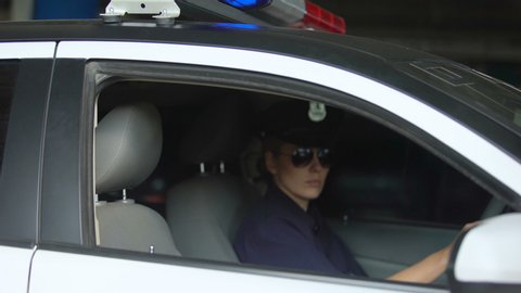 Female Police Officer Getting Into Car Stock Footage Video (100% ...
