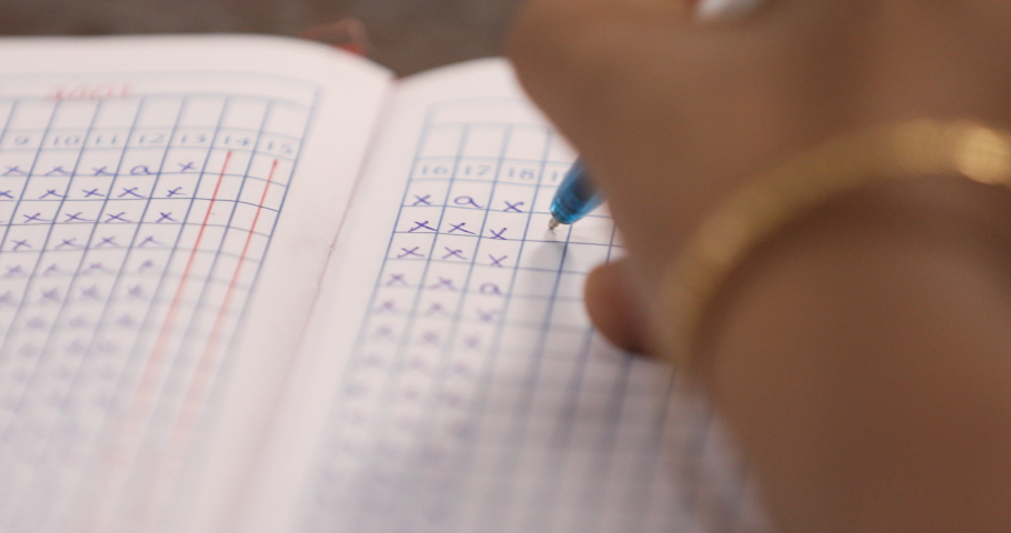 Teacher Checking Attendance Register in Stock Footage Video (100% ...