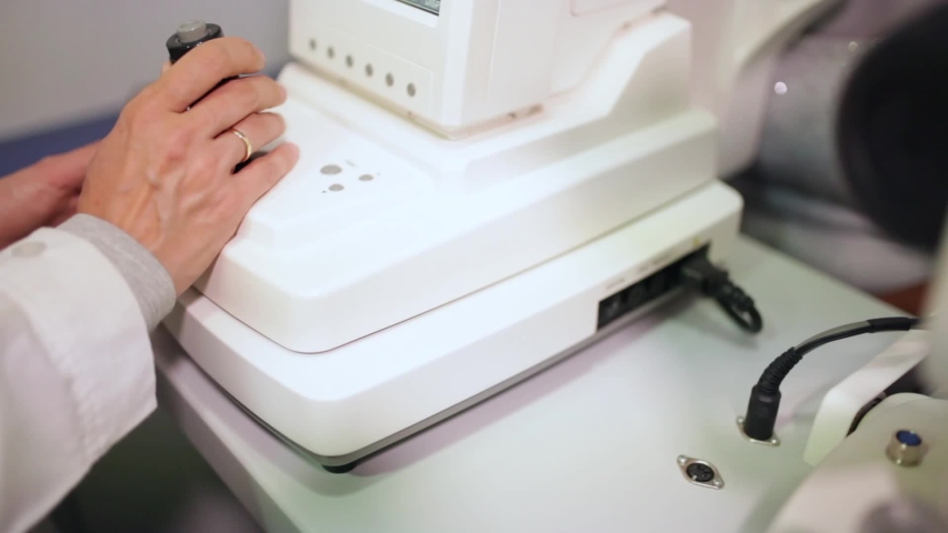 ophthalmologist's hand using ophthalmometer his optometry Stock Footage ...