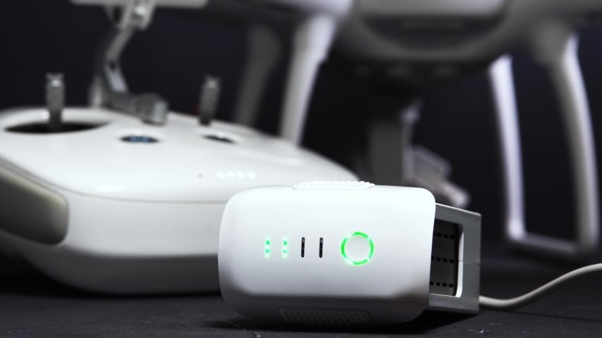 close-up drone's charger charging flashing green Stock Footage Video ...