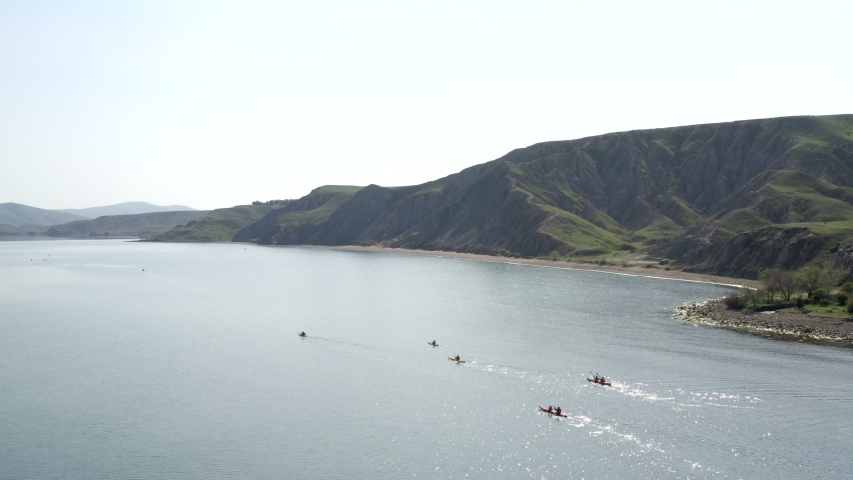 Landscape with hills with small canoes and boats image - Free stock ...