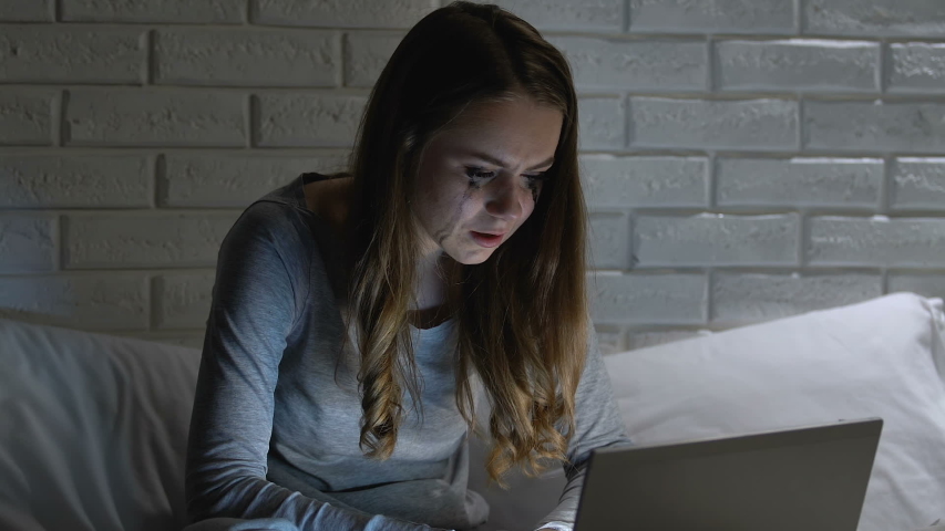 crying young woman typing on laptop Stock Footage Video (100% Royalty ...
