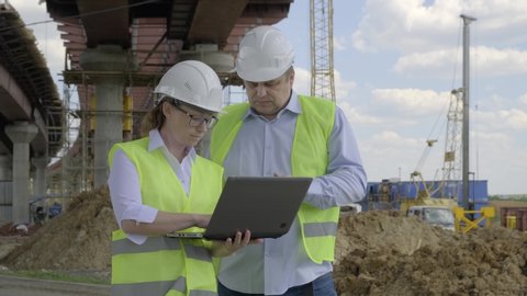 Two Young Engineers Walking Through Construction Stock Footage Video ...