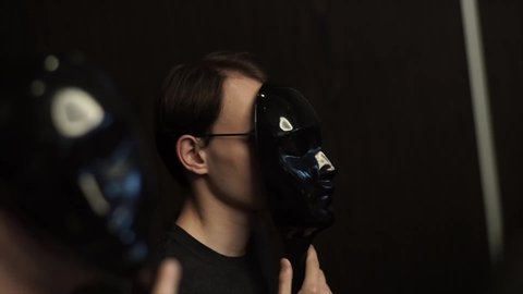 Man Covers His Face Black Mask Stock Footage Video (100% Royalty-free ...