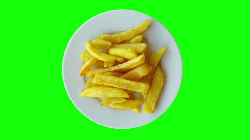 Fried potato chips rotating on white background in 4K with free place ...