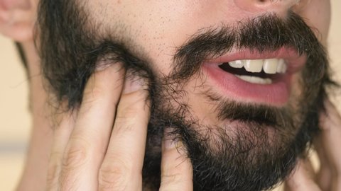 341 Scratch his beard Stock Video Footage - 4K and HD Video Clips ...