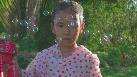 Asian Little Girl Rainwear Playing Bubble Stock Footage Video (100% ...
