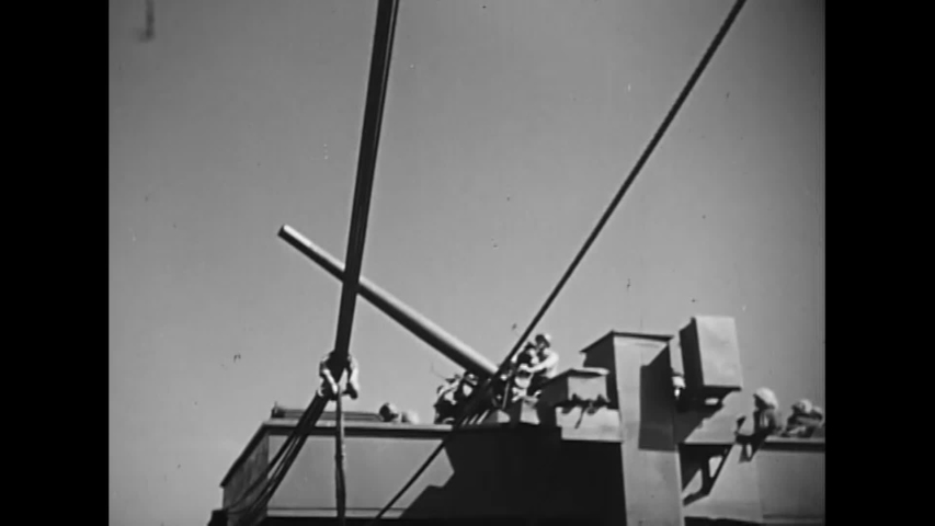 CIRCA 1940s - Soldiers fire naval guns and a damage is shown aboard a ...