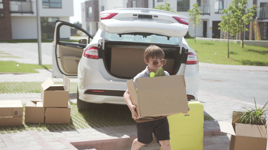 excited young boy kid carrying heavy Stock Footage Video (100% Royalty ...
