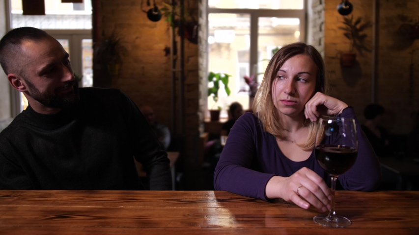 close-up annoying man pestering lonely female Stock Footage Video (100% ...