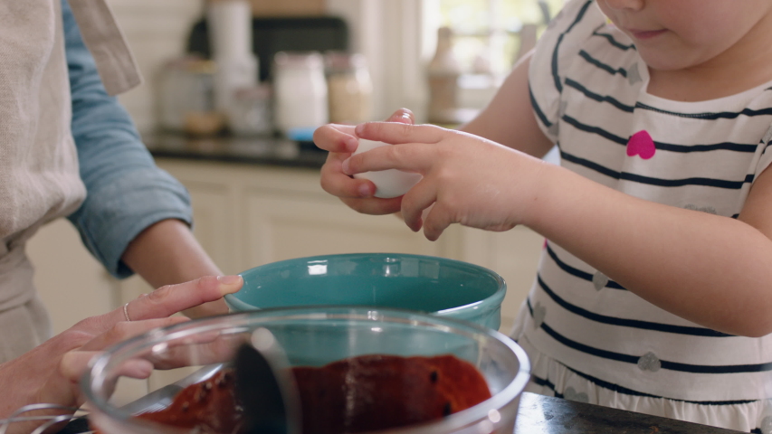 Beautiful Little Girl Helping Mother Bake Stock Footage Video (100% ...