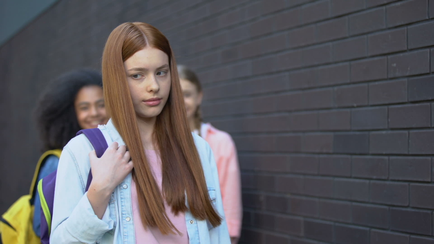 ashamed red-haired teenager passing by laughing Stock Footage Video ...