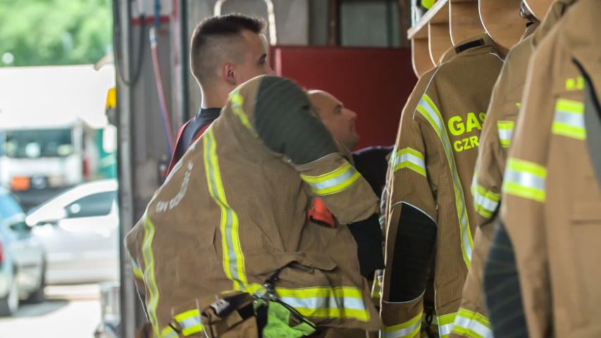 firefighters getting ready they're putting on Stock Footage Video (100% ...