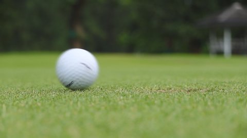 slow motion golf ball falls into Stock Footage Video (100% Royalty-free ...