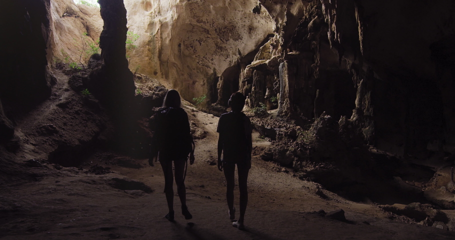 Tourists Woman Hikers Exploring Cave Stock Footage Video (100% Royalty ...