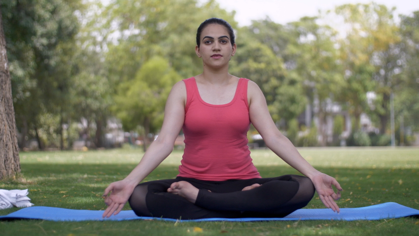 attractive indian woman doing breathing exercises Stock Footage Video ...