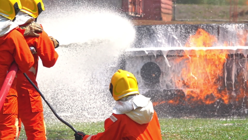 group firefighter teamwork fighting fire on Stock Footage Video (100% ...