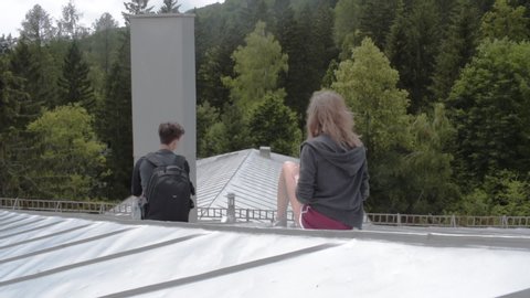 Two People Sitting On Roof Big Stock Footage Video (100% Royalty-free ...