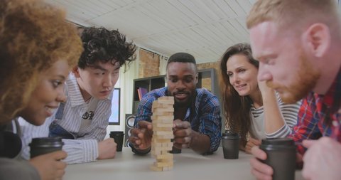 Multiracial Colleagues Play Board Games During Stock Footage Video (100 ...