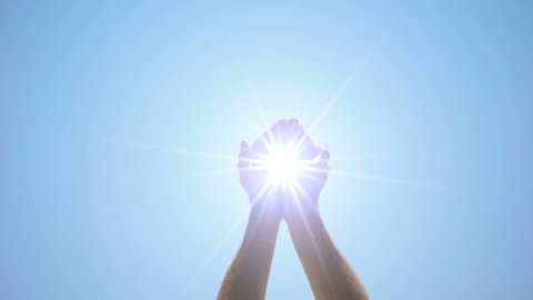 Hands Holding Sacred Light Against Blue Stock Footage Video (100% ...