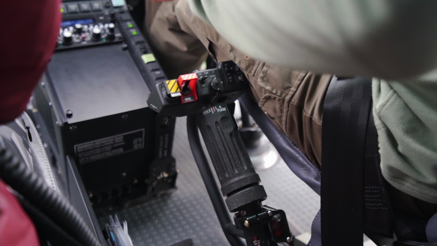 close-up helicopter pilot's hand grabbing control Stock Footage Video ...