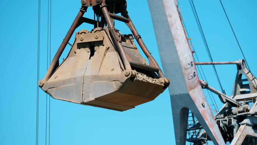 close mechanical bucket excavated gravel falling Stock Footage Video ...