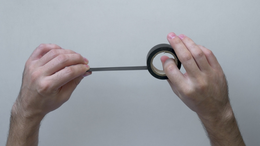 hands unwind roll black electrical tape Stock Footage Video (100% ...