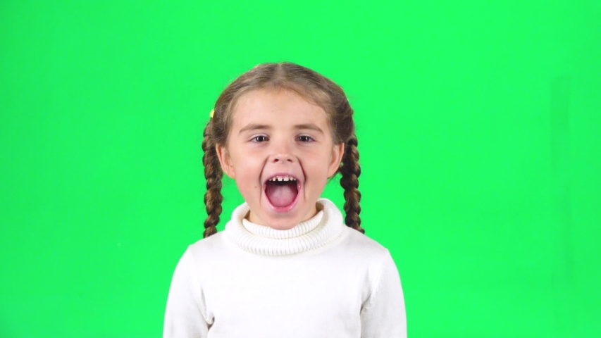 cute girl screaming smile on green Stock Footage Video (100% Royalty ...