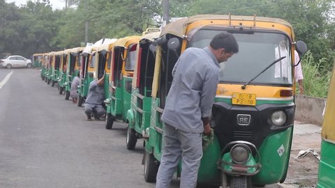 Auto Rickshaw Drivers Cleaning Their Vehicles Stock Footage Video (100% ...